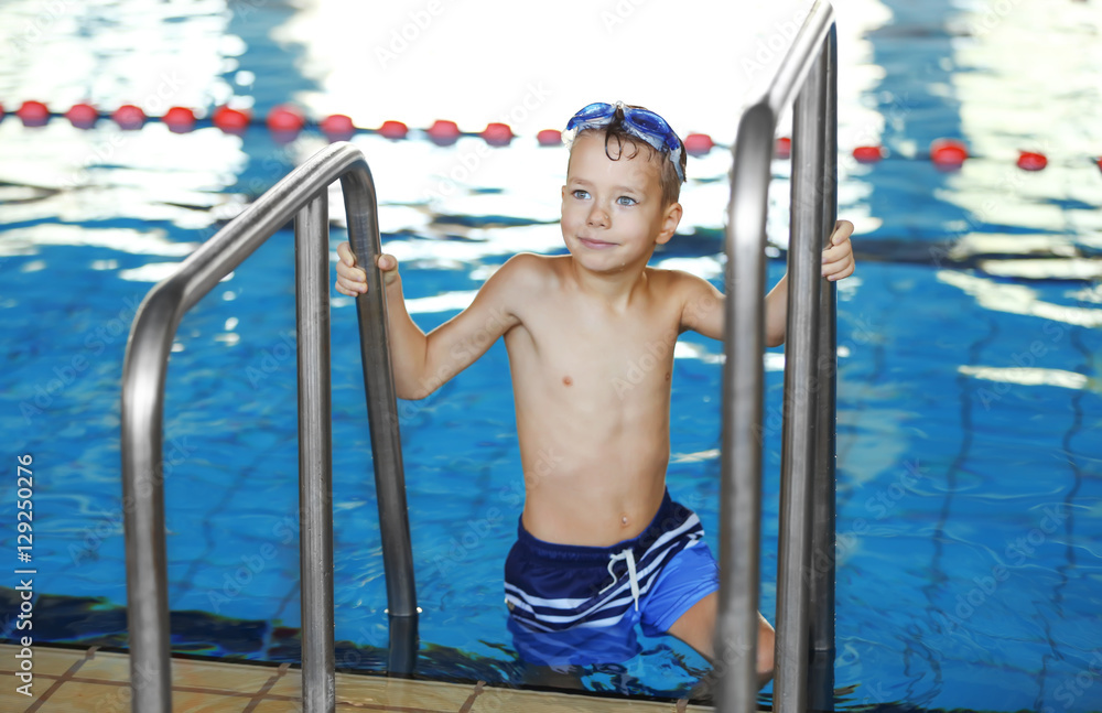 Cute boy in the sport swimming pool Stock Photo | Adobe Stock