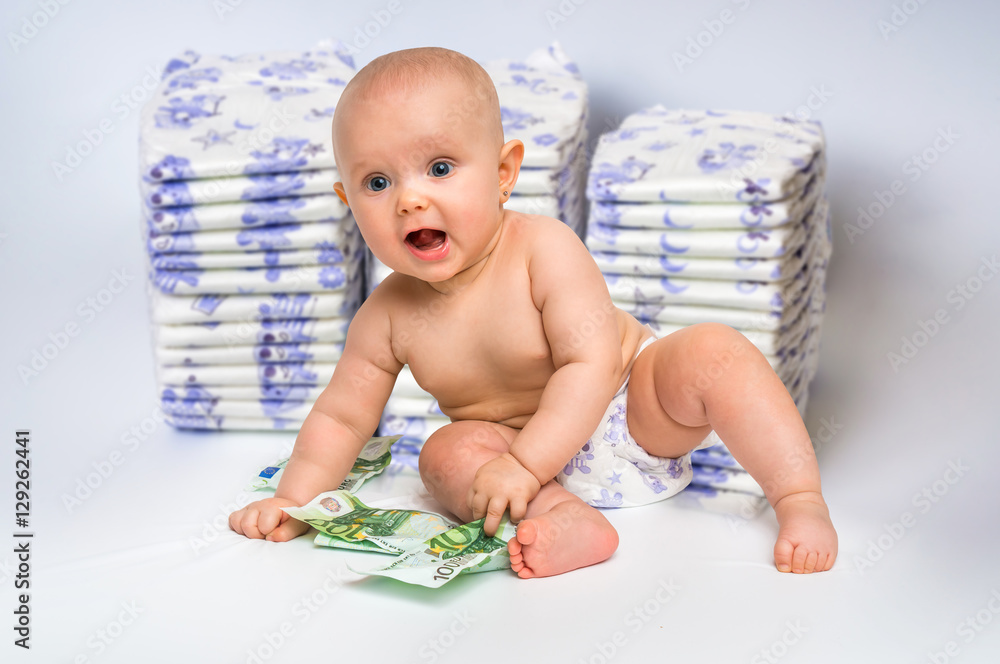 Cute baby with money isolated on blurry diapers background Stock Photo ...