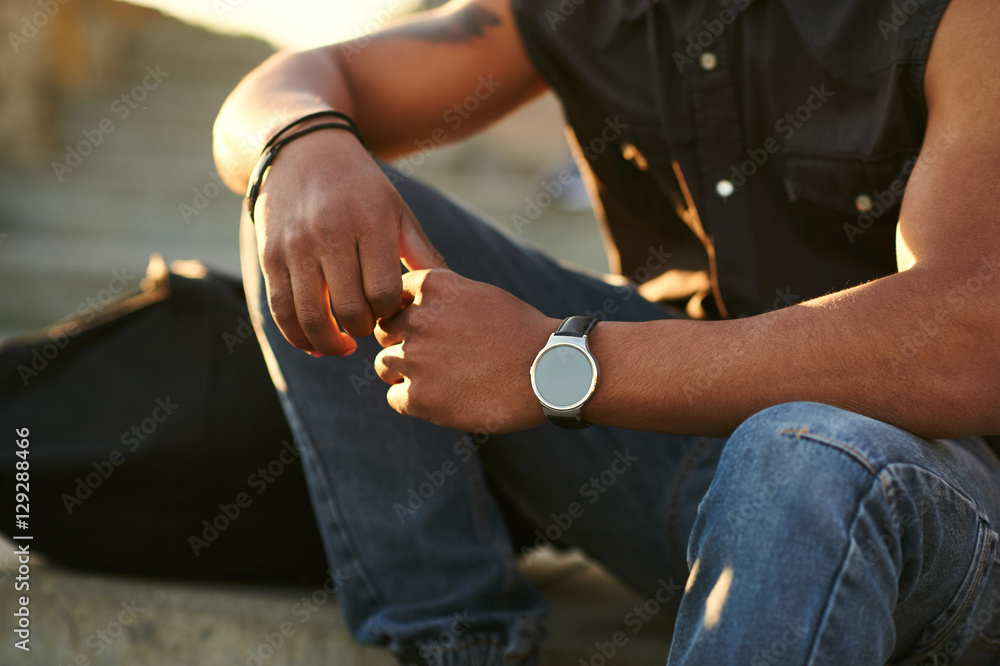 Young teenage man wears smart watch with touchscreen Stock Photo ...