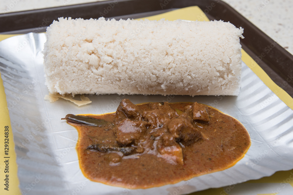 Puttu or Pittu with beef curry, steamed rice cake and meat curry Kerala ...