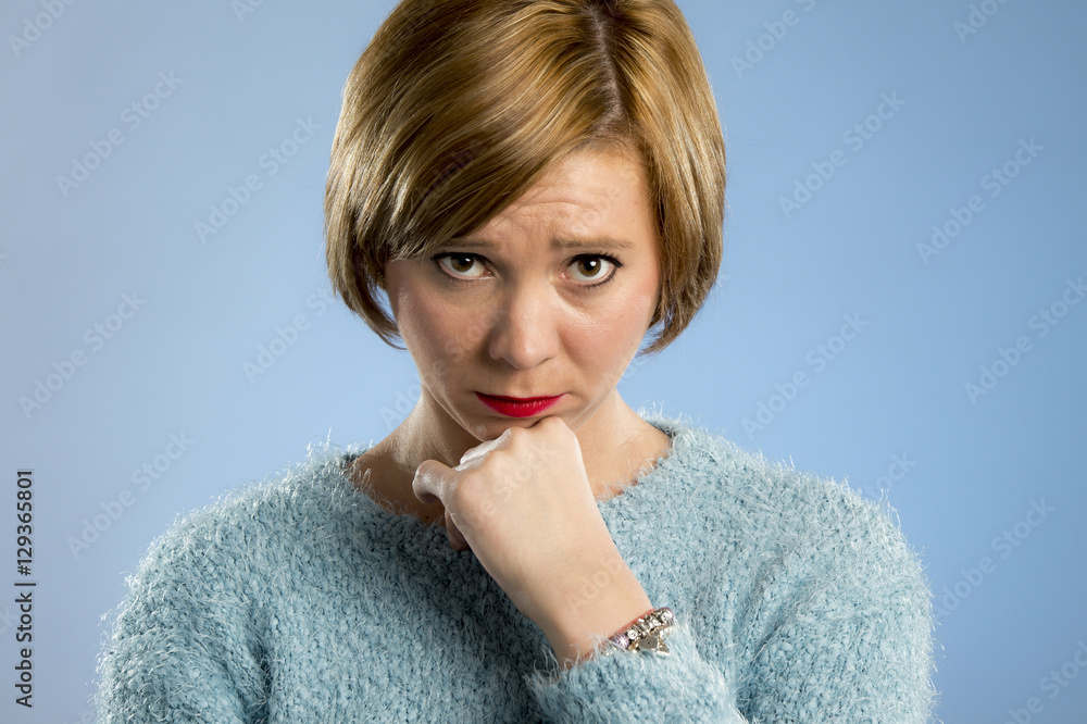 woman looking suspicious and sad in guilty and sorry face expression ...