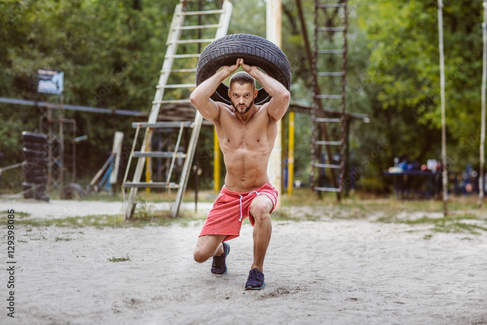Attractive fittness man doing exercises outdoors. Sport,cross-fit ...