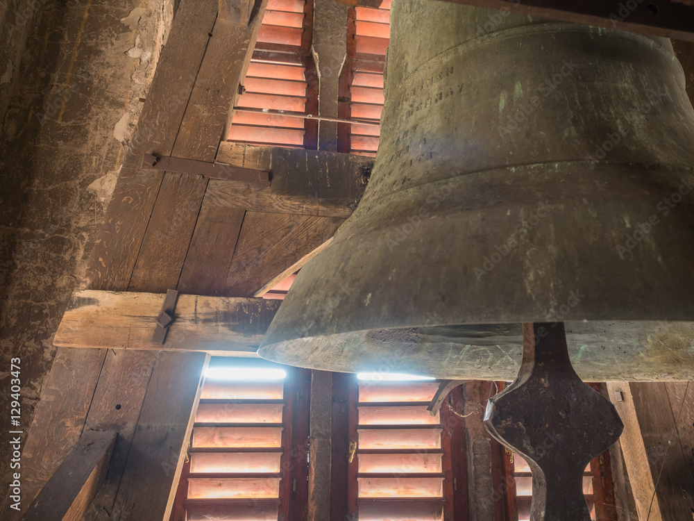 Picture of an old church bell in wooden belfry close up. An old wooden ...