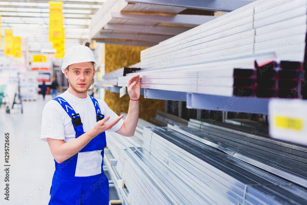 friendly hardware store assistant. happy male hardware store worker ...
