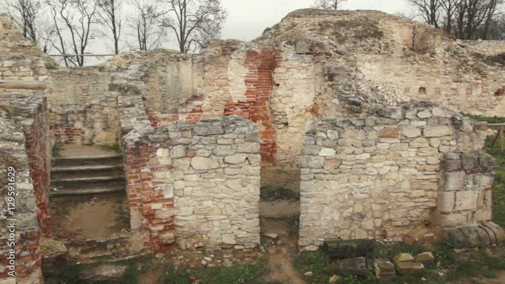 camera slide over walls of ruins of medieval castle in city of ilza in ...