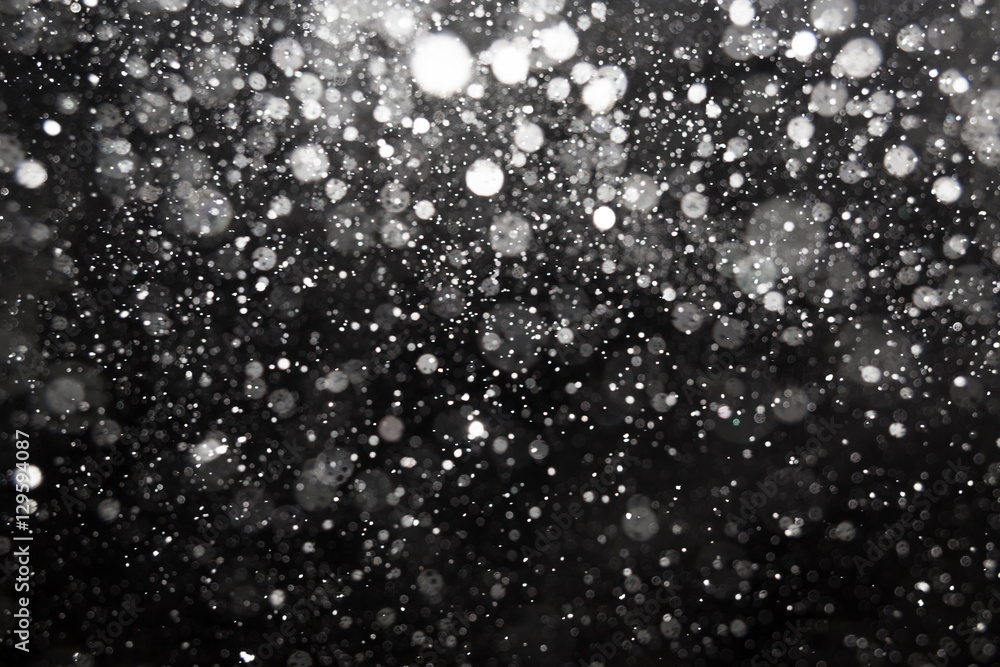 Falling snow on black background Stock Photo | Adobe Stock
