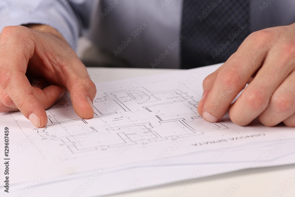 Architect pointing on project drawing, Project Manager showing house ...