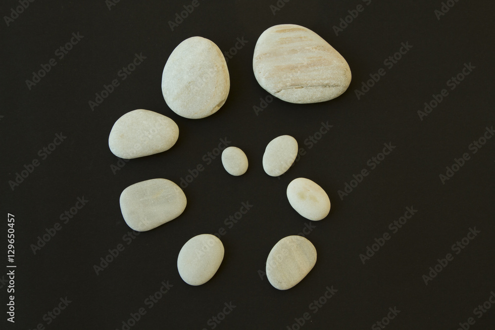 Curve from pebble stones on black background Stock Photo | Adobe Stock