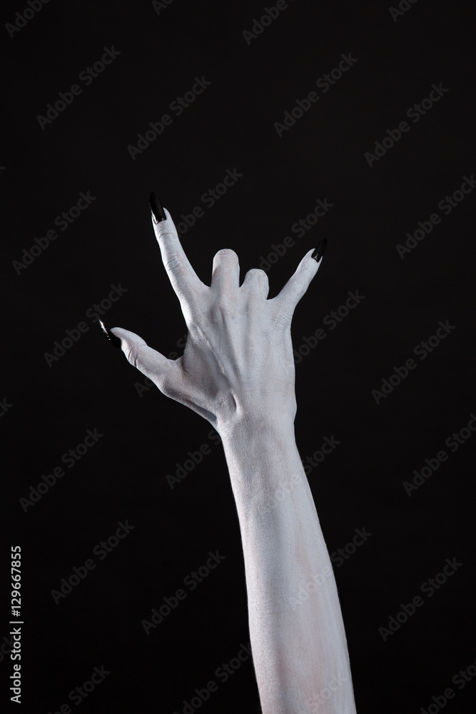 Pale monster hand showing heavy metal symbol Stock Photo | Adobe Stock