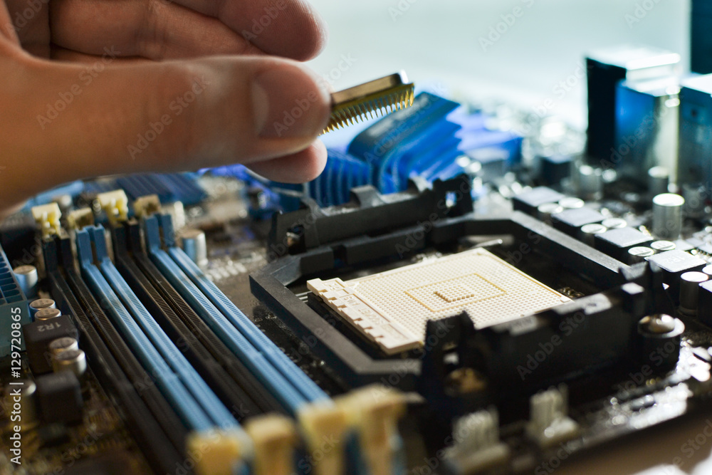 Installing the CPU into the motherboard Stock Photo | Adobe Stock