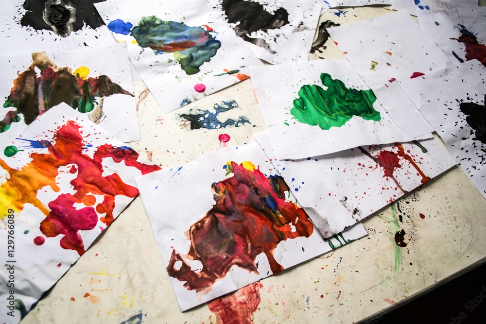 Many red colored blots on white paper with streaks. Abstract creative ...