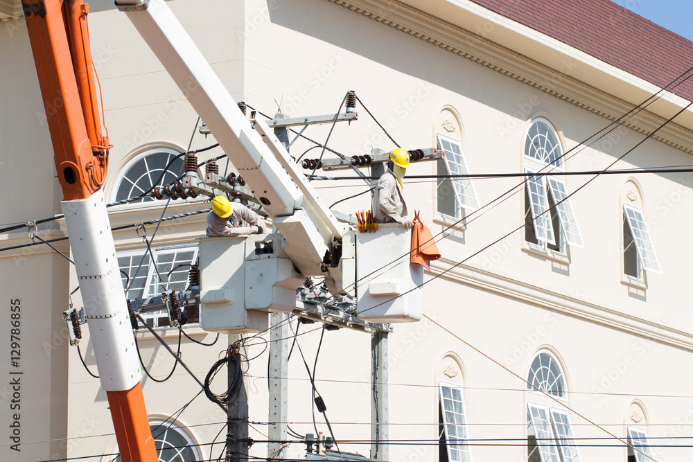 electricians repairing wire of the power line on electric power Stock ...