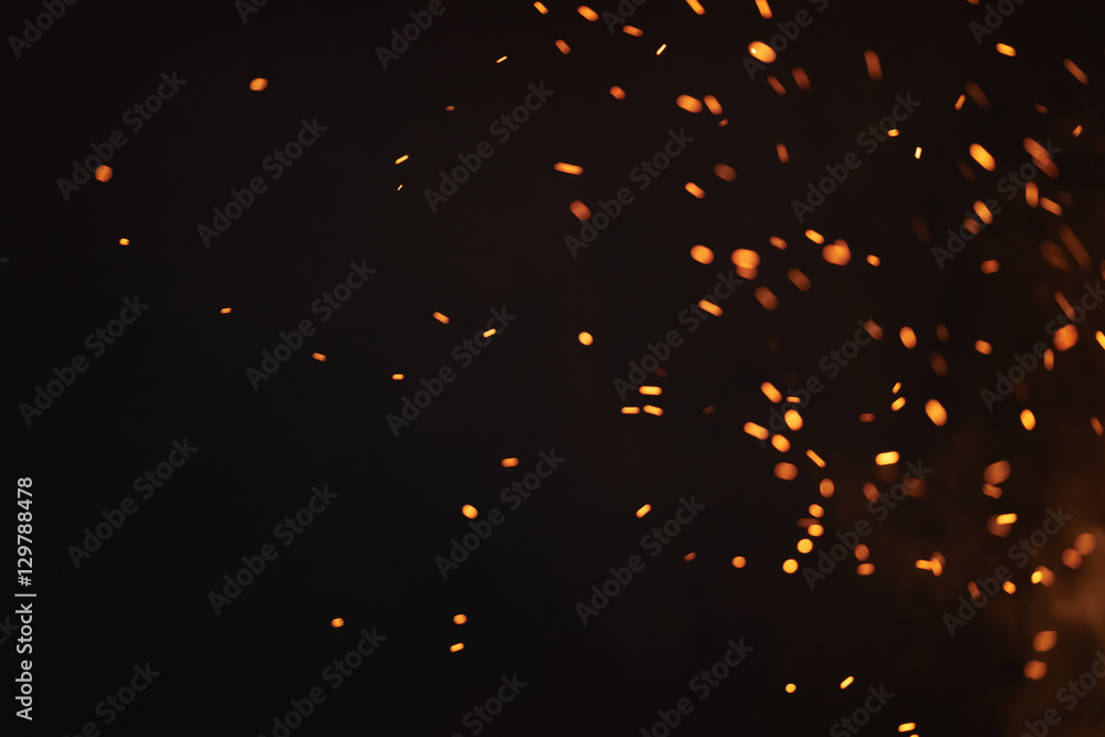 sparks from bonfire over dark night environment, shallow focus Stock ...