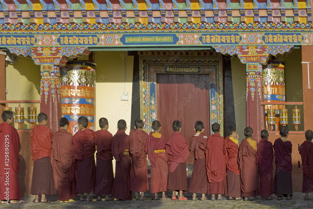 Novice monks line up in front of monastic building at the new Karma ...