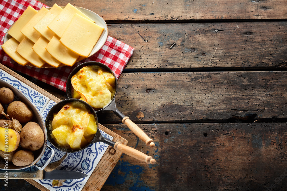 Delicious traditional Swiss melted raclette cheese Stock Photo | Adobe ...