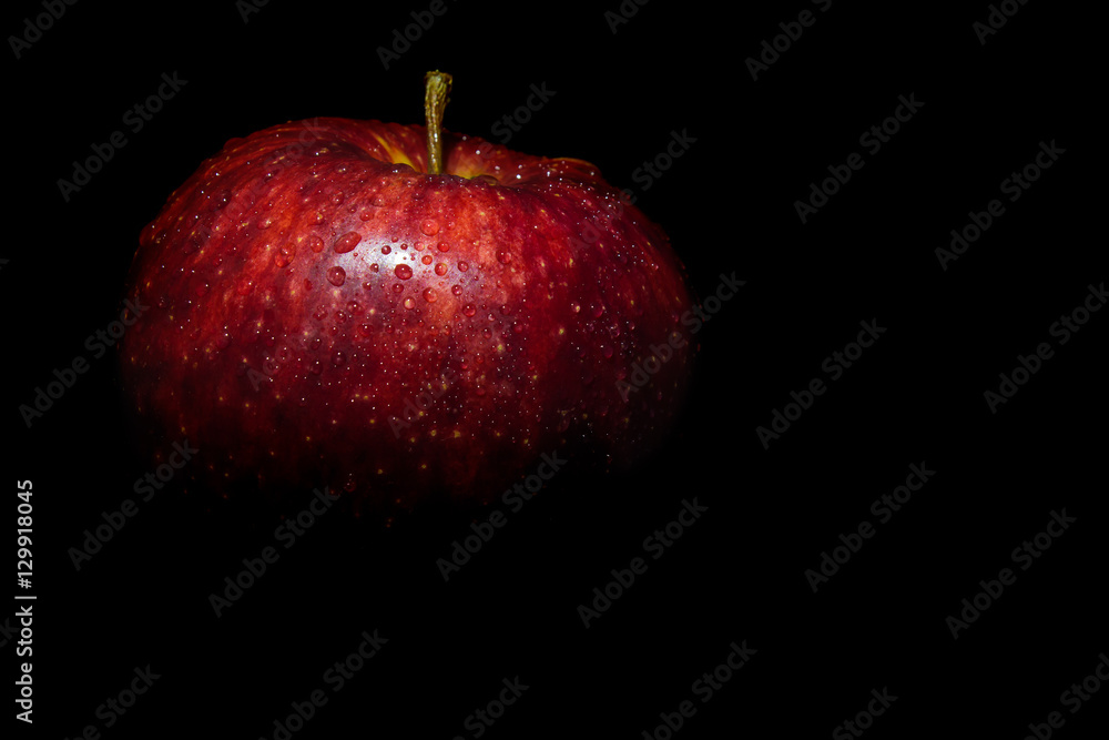 red apple on a black background Stock Photo | Adobe Stock