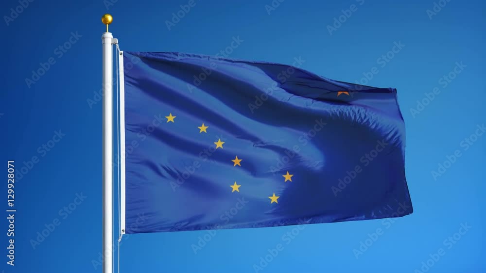 Alaska (U.S. state) flag waving in slow motion against blue sky ...