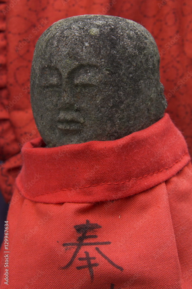 Small stone figure wearing traditional red dress, Nanzen Ji shrine ...