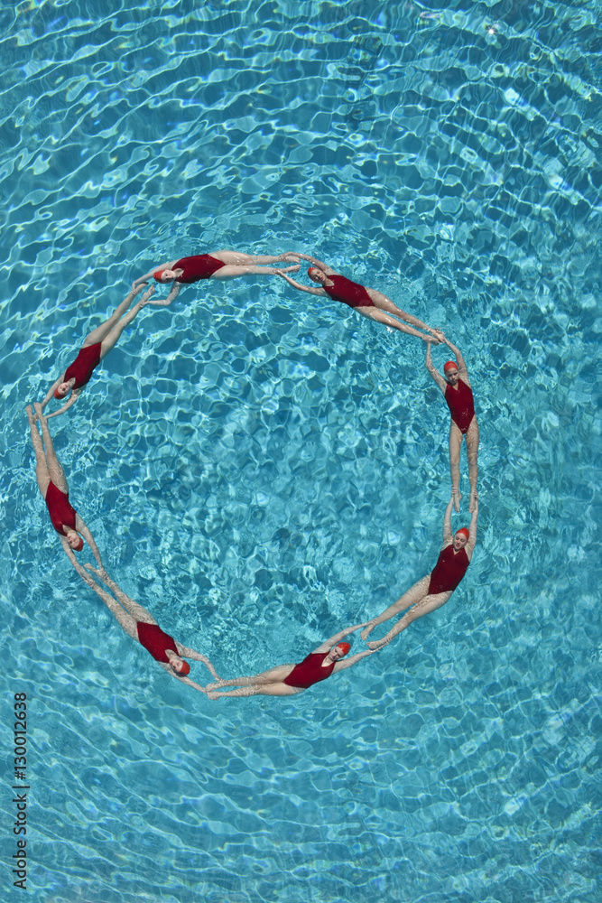 Group of synchronized swimmers forming a circle in pool Stock Photo ... Group of synchronized swimmers forming a circle in pool Stock Photo ...