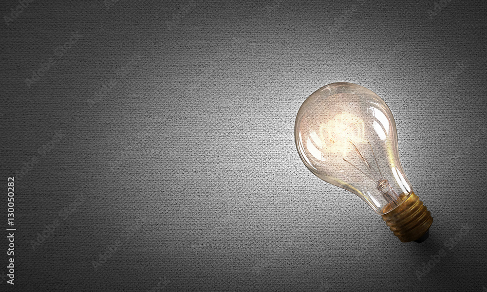 Electric bulb on texture . Mixed media foto de Stock | Adobe Stock