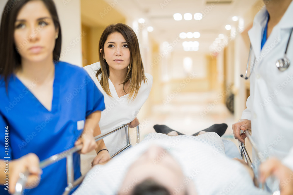 Transporting patient in a hospital hallway Stock Photo | Adobe Stock