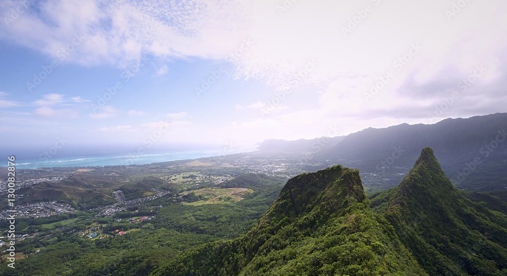 Hiking along the Olamana Three Peaks in Oahu, Hawaii on a clear day ...