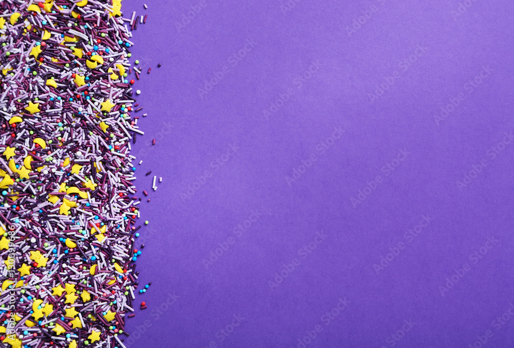 Colorful sprinkles on the purple background Stock Photo | Adobe Stock