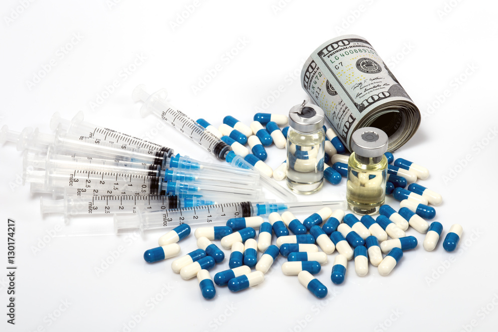 Stock of pills, syringes and ampules with liquid drugs and money to buy ...