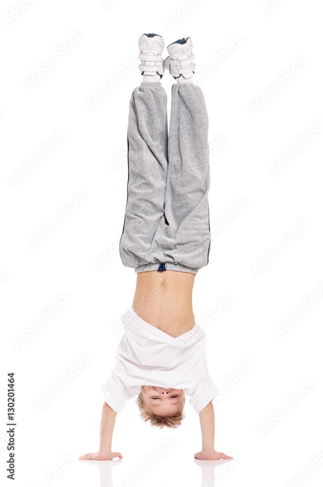 Little boy dancing on white foto de Stock | Adobe Stock
