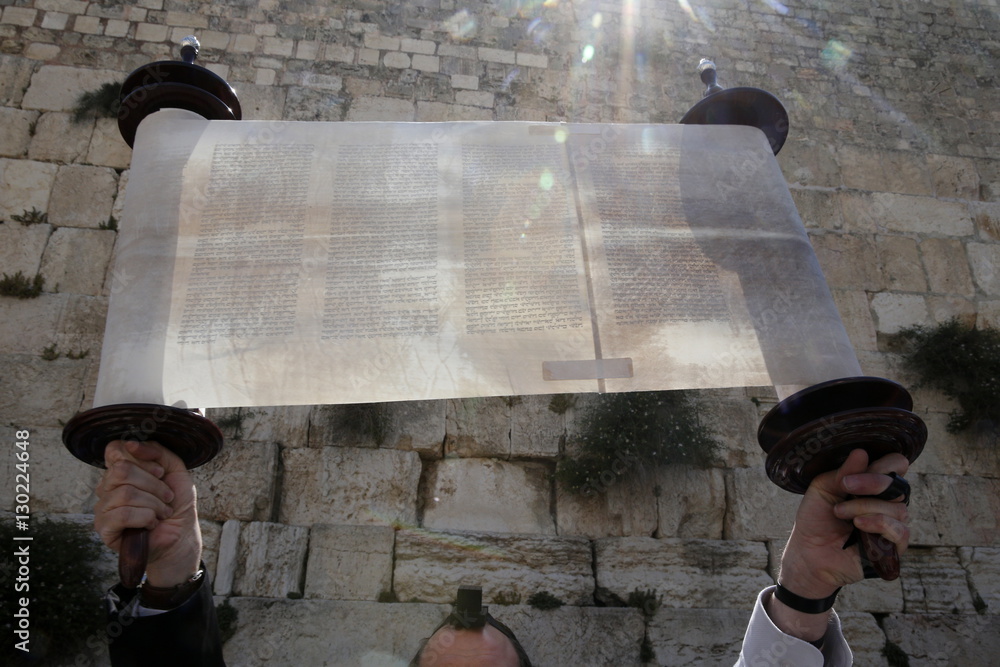 A ceremonial reading of the Torah from Torah scroll under the Western ...