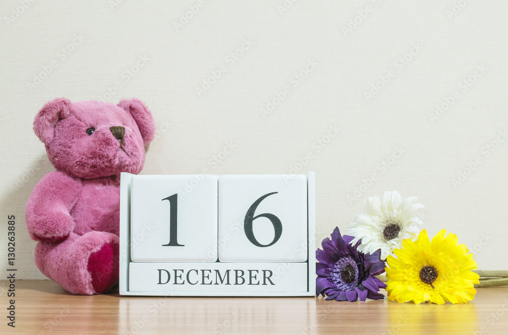 Closeup surface white wooden calendar with black 16 december word on ...