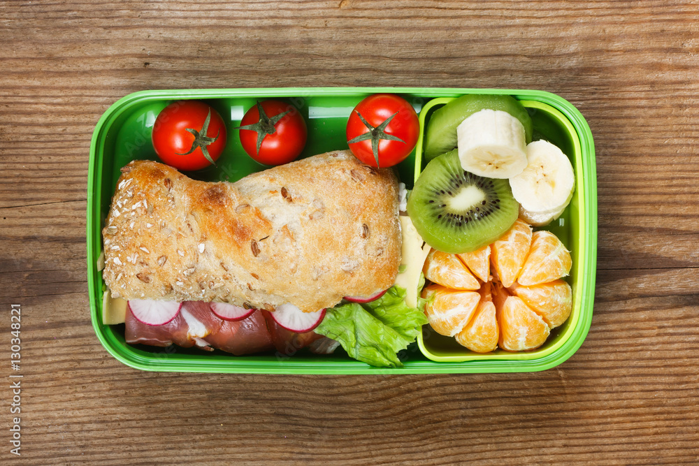 Lunchbox on wooden table Stock Photo | Adobe Stock