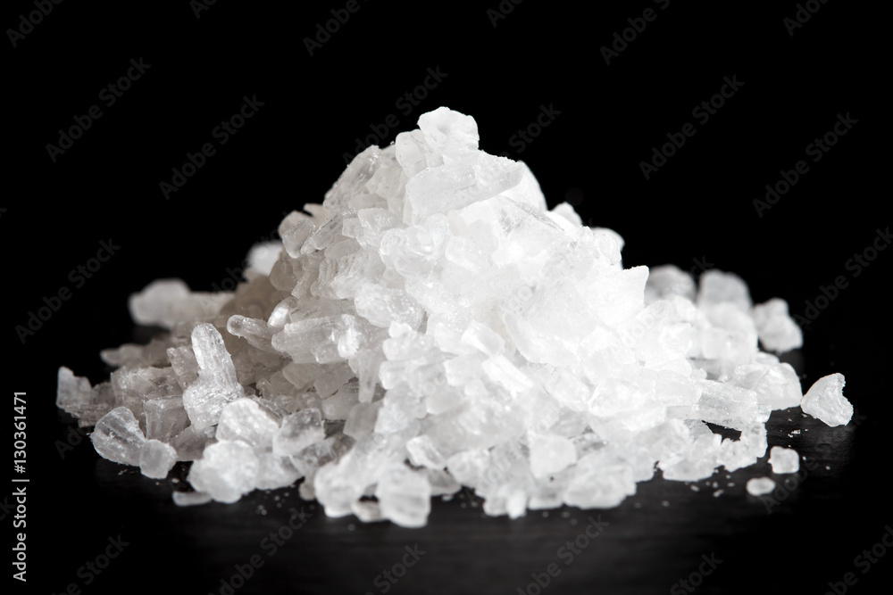 Heap of coarse salt isolated on black. Stock Photo | Adobe Stock