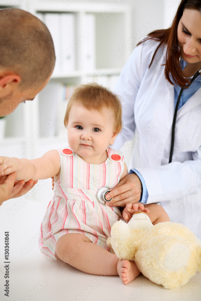 Happy cute baby at health exam at doctor's office. Medicine and health ...