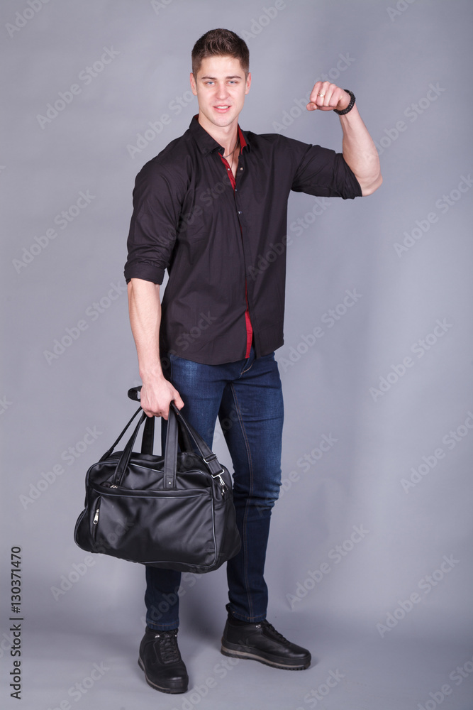 Studio photography, young strong tall, handsome man wearing a black ...