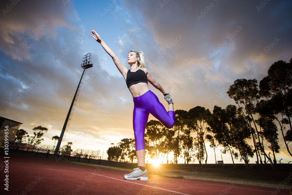 Beautiful female fitness model stretching and training on athlet Stock ...
