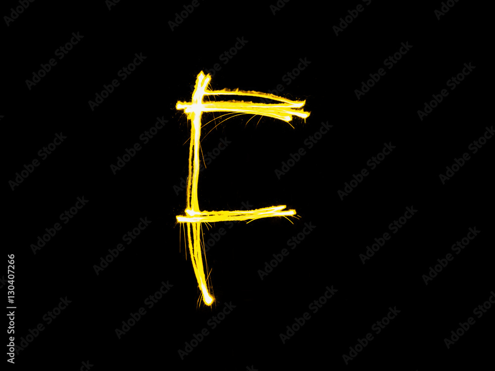 Sparkler firework light alphabet F (Capital Letters) at night ba Stock ...