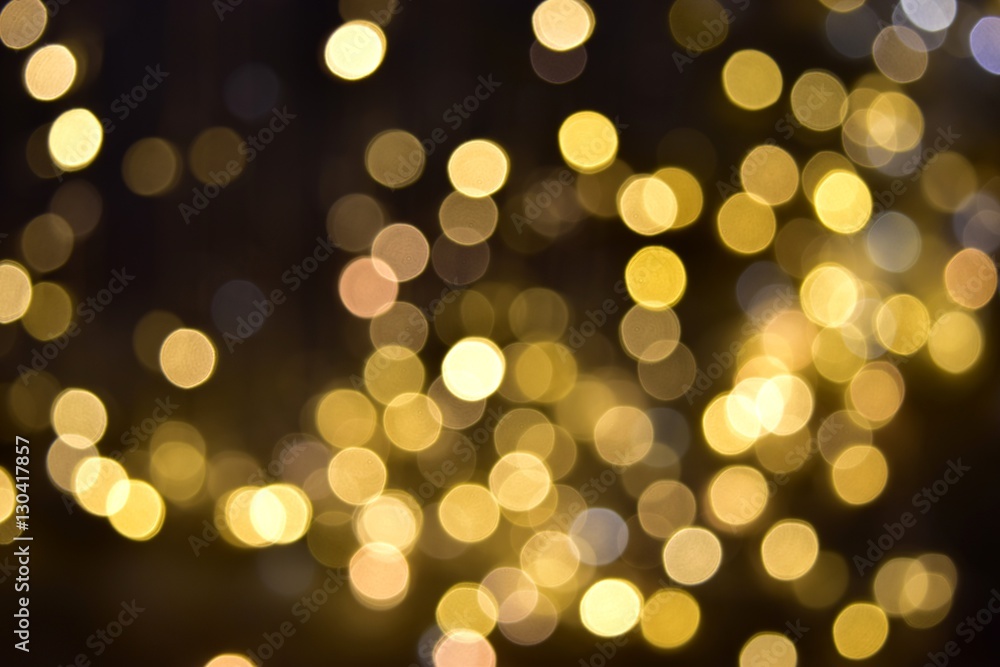 Glittering bokeh circular gold on black background . Stock Photo | Adobe Stock