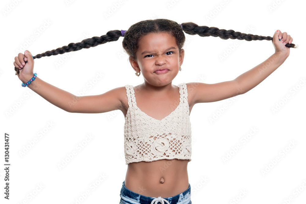 Cute African American Small Girl With A Funny Angry Face Pulling Her