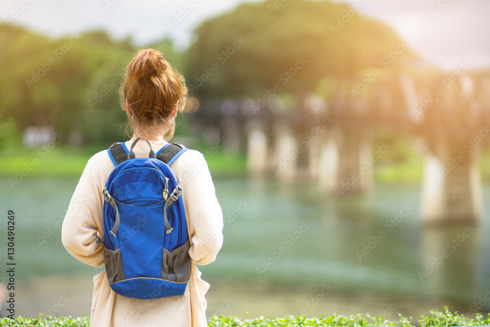 Teen girl standing in a blue backpack on the train to travel... Stock ...