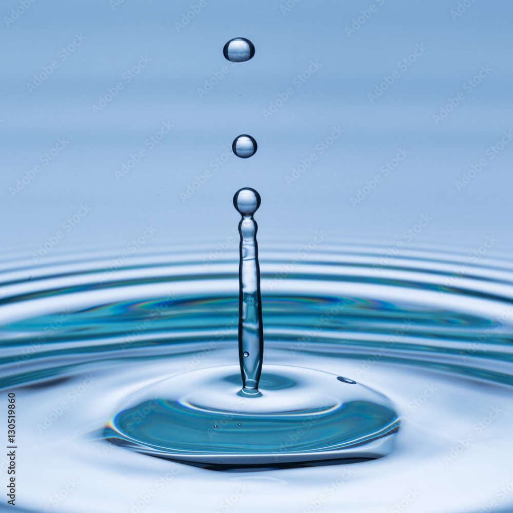 Water drop falling into water. Stock Photo | Adobe Stock