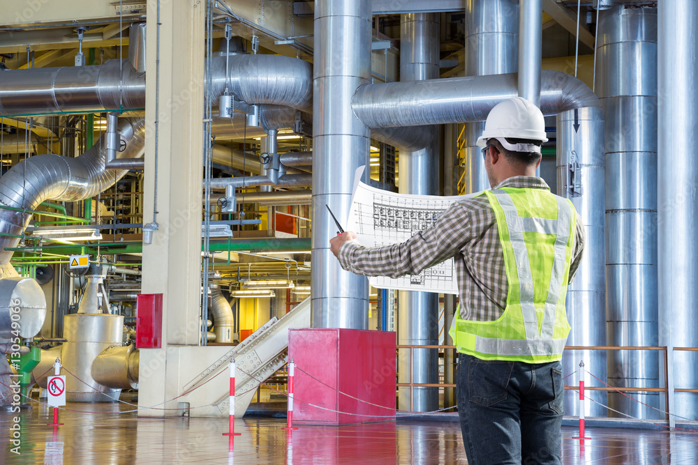 Engineer reading drawing diagram for maintance at thermal power Stock ...