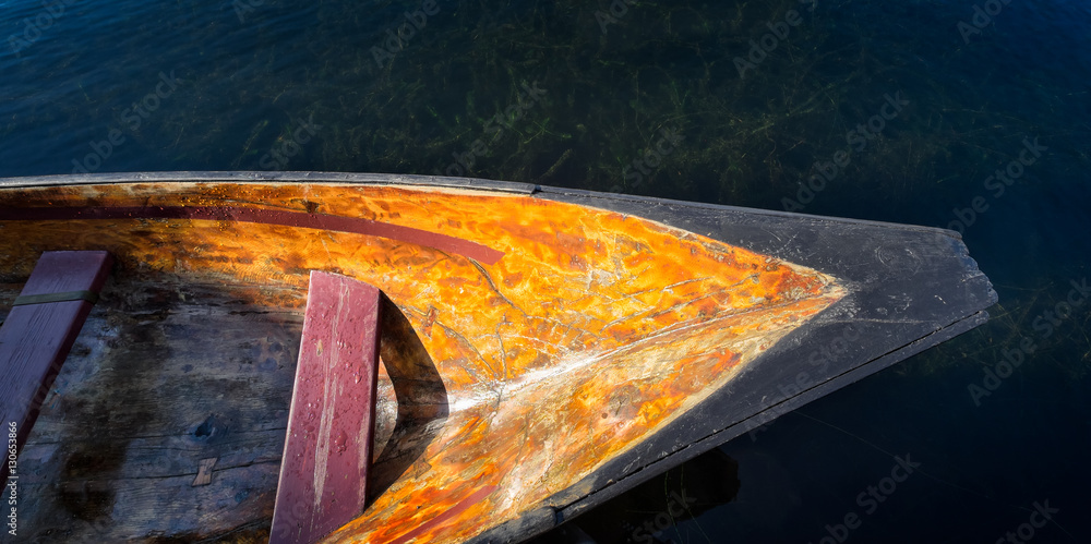 Dugout Native American canoe floating in water. Top view close up ...