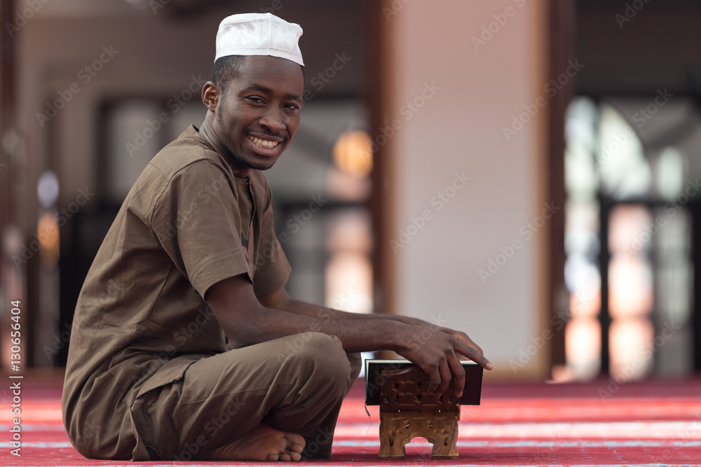 Black African Muslim Man Reading Holy Islamic Book Koran Stock Photo ...