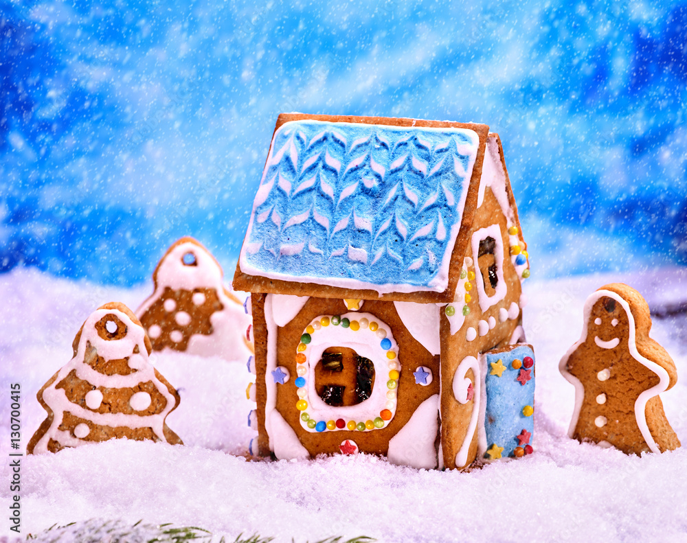 Gingerbread man , house near tree Christmas cookie with blue sky and ...