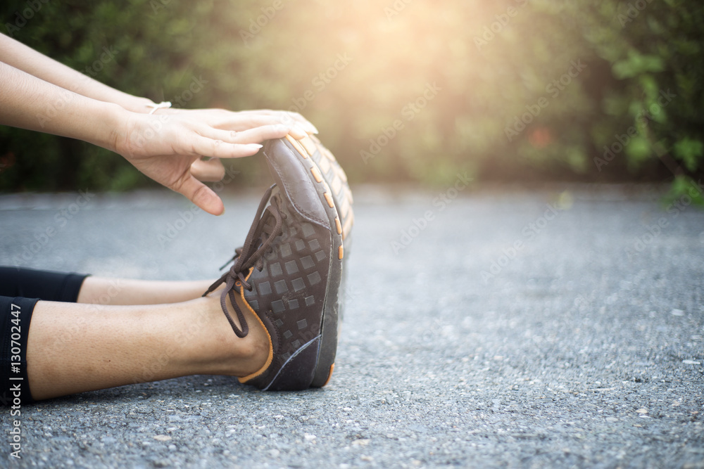 Close up of legs and hand of women. Photos | Adobe Stock