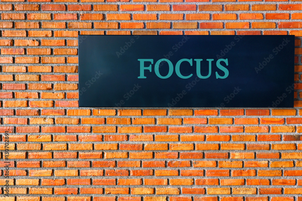 Focus letters on a black background with brick wall Stock Photo | Adobe ...