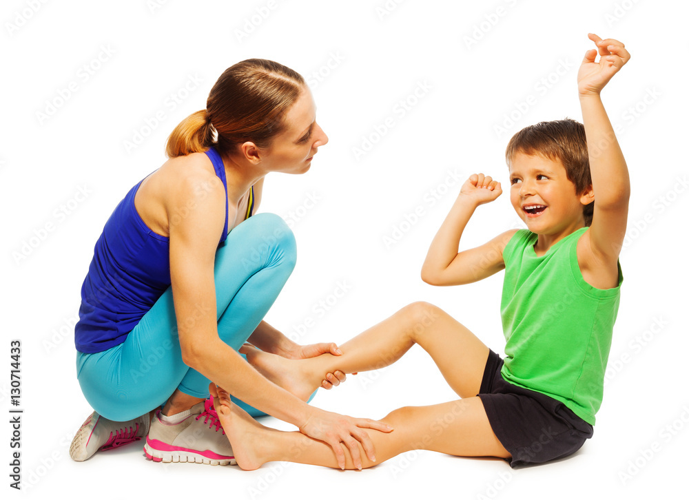Happy boy doing physical exercises with trainer Stock Photo | Adobe Stock