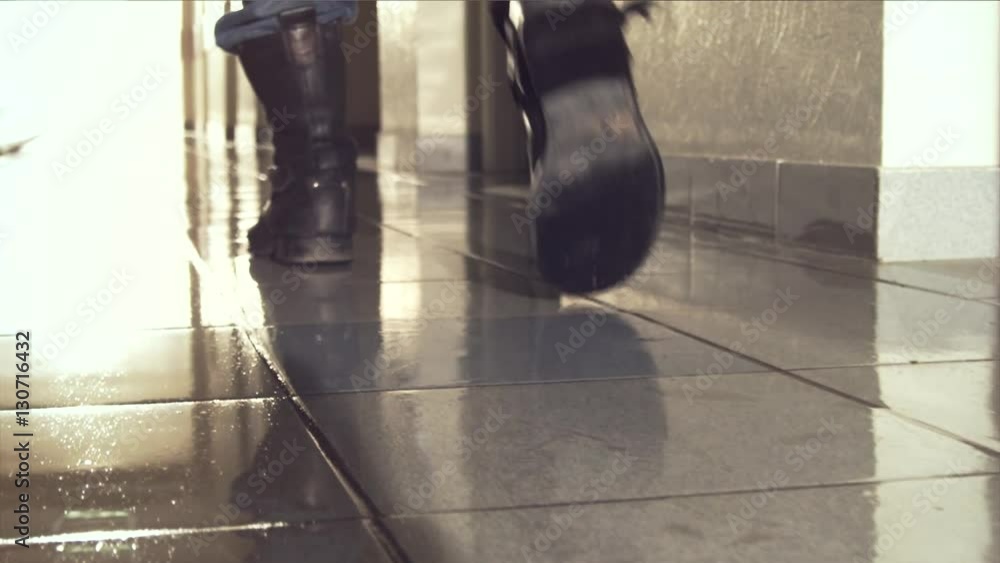 Heavy footsteps along the corridor. The old boots in slow motion ...