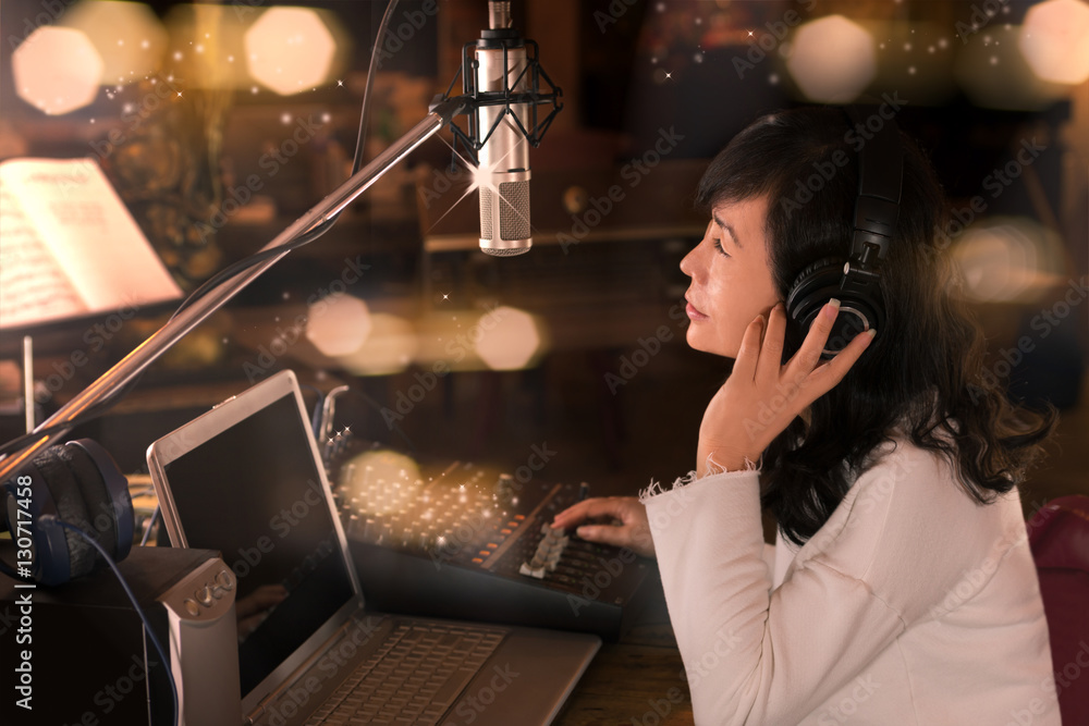 Female DJ live chatting with radio listeners with a happy face ...